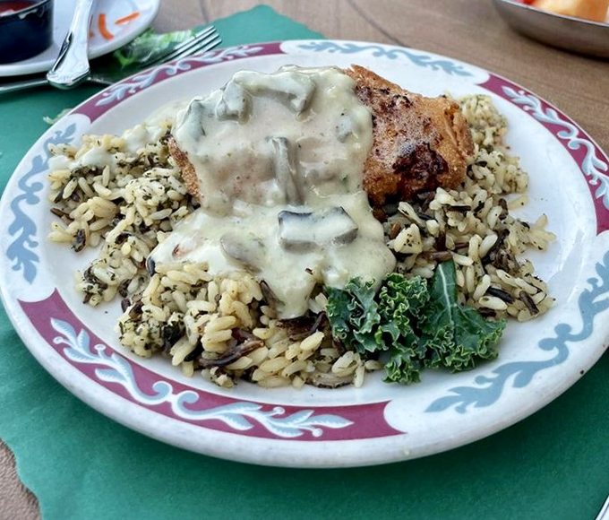 Chicken smothered in creamy mushroom sauce atop wild rice&mdash;the kind of dish that makes you want to hug the chef, then ask for the recipe.
