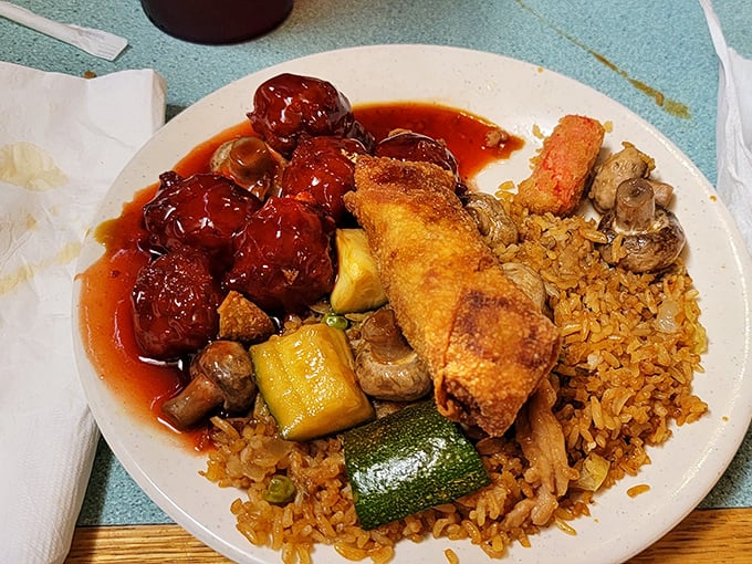 Those sweet and sour meatballs look like they're ready to steal the show, while the fried rice patiently waits its turn.