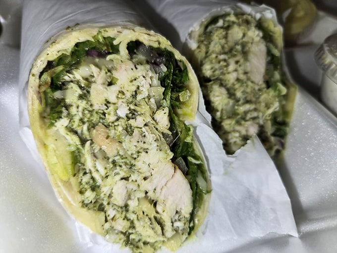 The chicken pesto wrap &ndash; where Italian flavors meet portable convenience in a handheld package that makes desk lunches suddenly exciting again.