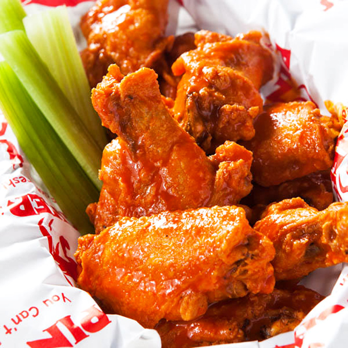 Buffalo wings with enough heat to make you notice, but not so much that you can't taste the perfectly crispy skin and juicy meat.