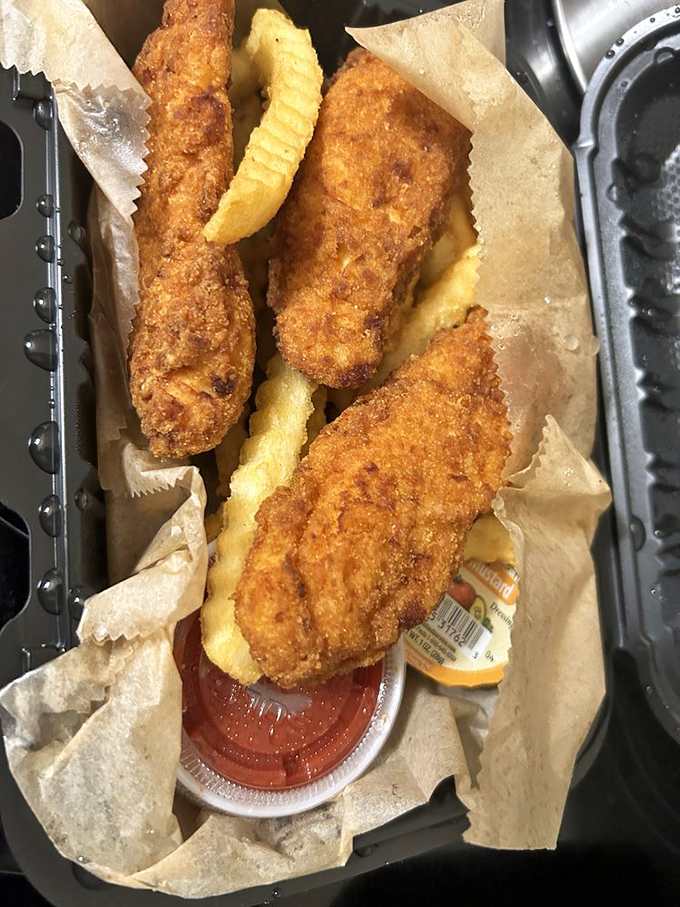 Golden-fried perfection with crinkle-cut companions. These chicken tenders aren't just for kids&mdash;they're a crispy trip down memory lane.