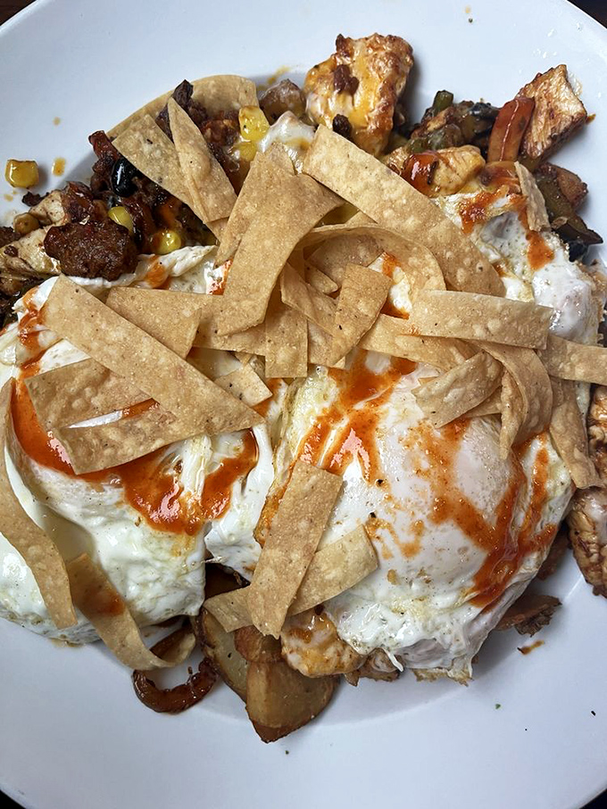 Chilaquiles that bring a fiesta to your morning – crispy tortilla strips, eggs, and a kick of heat that'll wake you up better than your second cup of coffee.