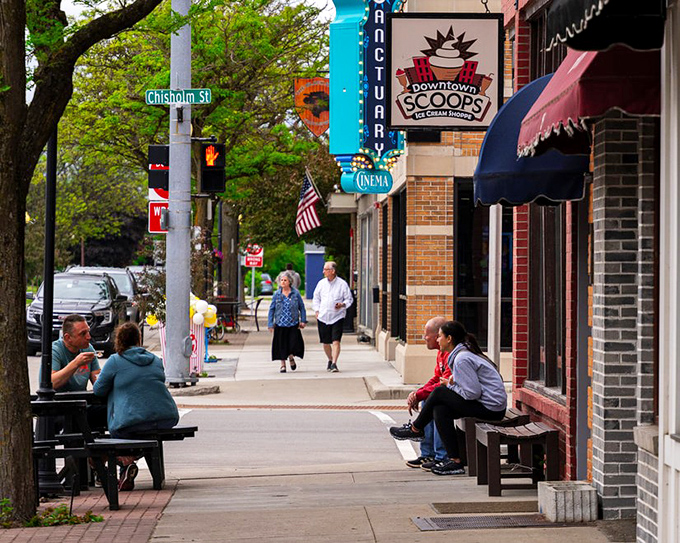 Downtown Scoops ice cream beckons on Chisholm Street, where locals gather on benches to watch the world stroll by.
