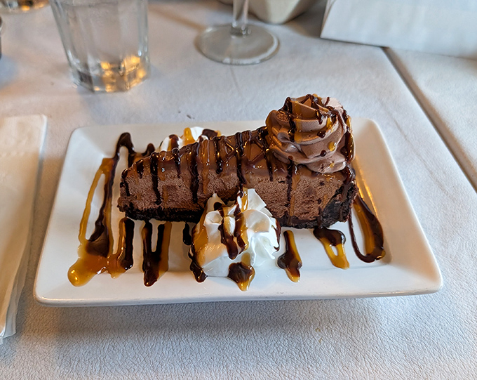 Chocolate dessert so decadent it should come with a warning label. Those sauce drizzles aren't decoration—they're an invitation to indulge.