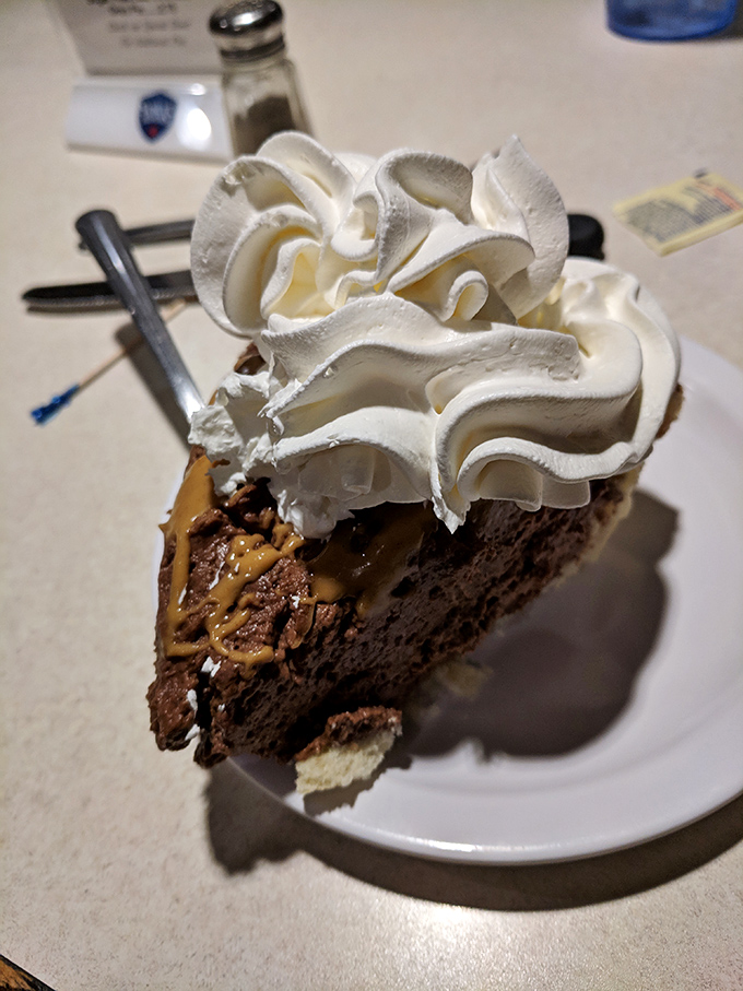 Chocolate peanut butter pie with a mountain of whipped cream &ndash; the kind of dessert that makes you wonder why you'd ever waste calories on anything less magnificent.