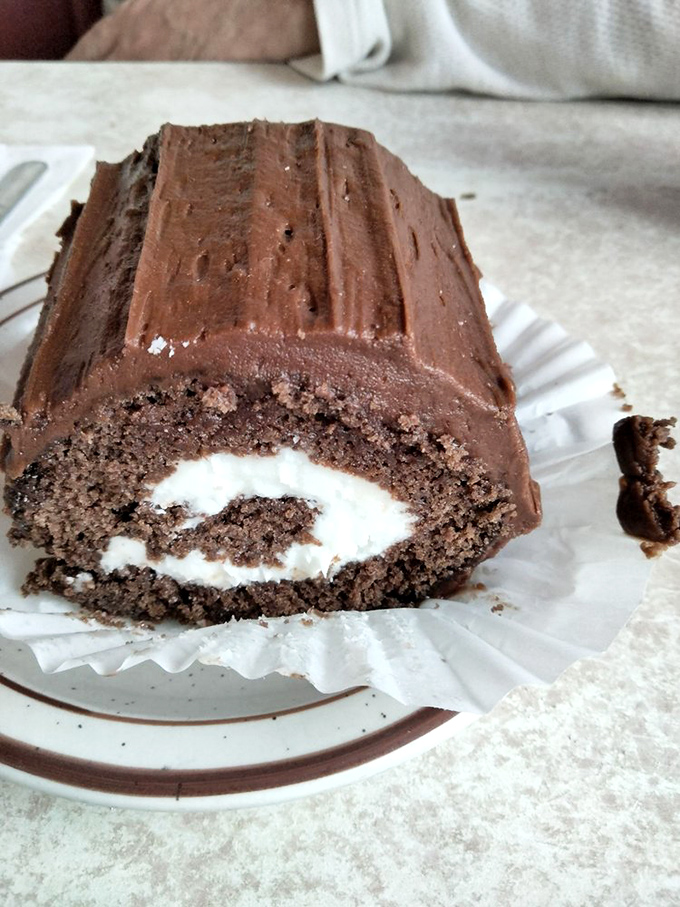 A chocolate roll that spirals into happiness with each bite, combining cake and cream in perfect harmony.