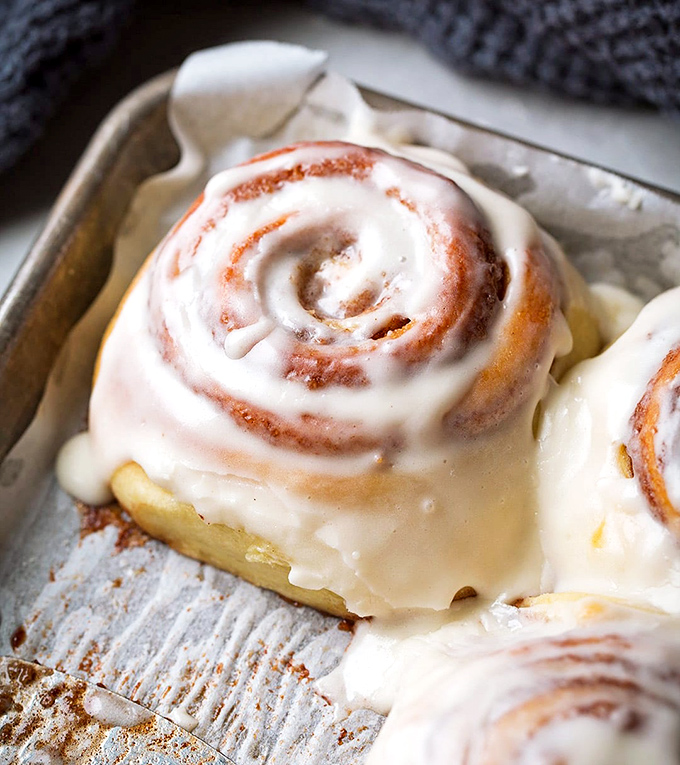 The humble cinnamon roll &ndash; proof that spirals aren't just for galaxies, and that frosting is nature's way of saying "Good morning, champion."