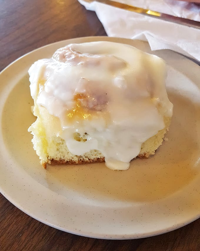 Cinnamon roll that doesn't understand the concept of personal space. That cream cheese frosting melts into every warm, cinnamon-scented crevice.