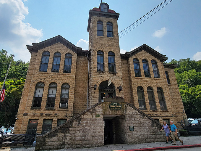 City Hall commands attention with its imposing stone presence, looking more like a castle than a place to pay your water bill.