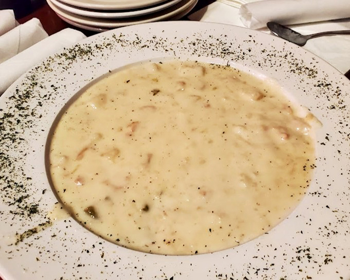 This clam chowder isn't just soup &ndash; it's a creamy ocean hug in a bowl, with herbs sprinkled around the rim like a flavor runway.
