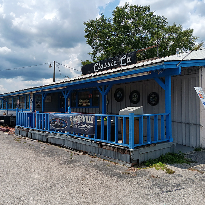 Classic Cafe's weathered blue porch railing welcomes hungry travelers. Sometimes the best Florida flavors hide in the most unassuming packages.