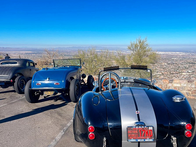 Classic cars meet classic views. These vintage beauties somehow make the already spectacular panorama feel like a scene from a timeless road movie.