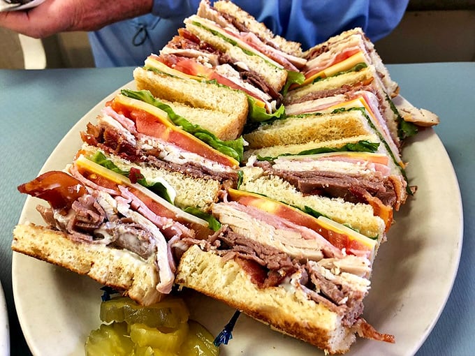 Club sandwich architecture at its finest &ndash; layers upon layers of deli goodness that would make a skyscraper engineer proud.