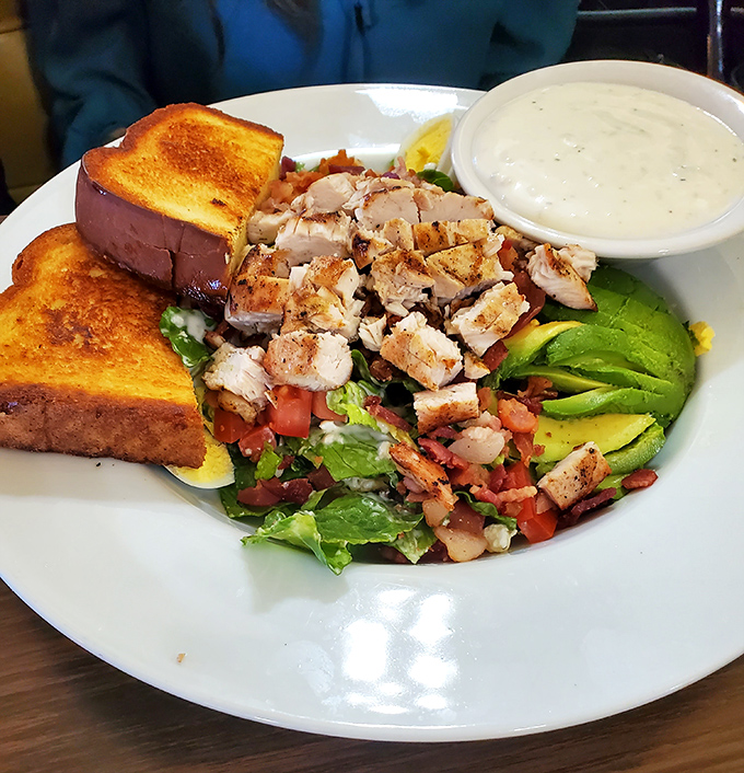 A Cobb salad that actually makes eating healthy feel like cheating – crisp, colorful, and substantial enough to satisfy even the hungriest cowpoke.