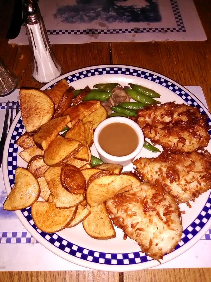 Golden-crusted coconut chicken with handcut fries &ndash; comfort food elevated to an art form without losing its soul-satisfying simplicity.