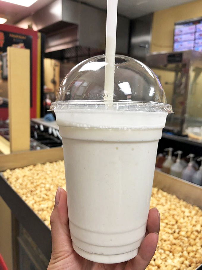The coconut milkshake stands tall and proud, a tropical vacation in a cup that doesn't require sunscreen or flight delays.