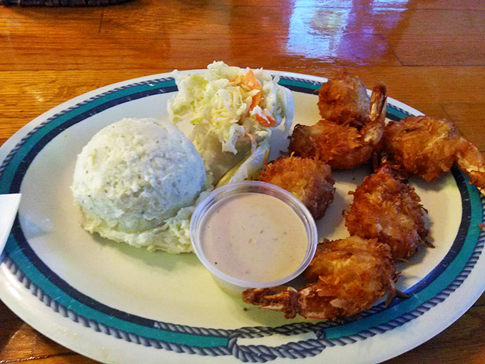 Coconut shrimp arrives golden and crispy, each bite delivering that sweet-savory combination that never gets old, no matter how many times you order it.