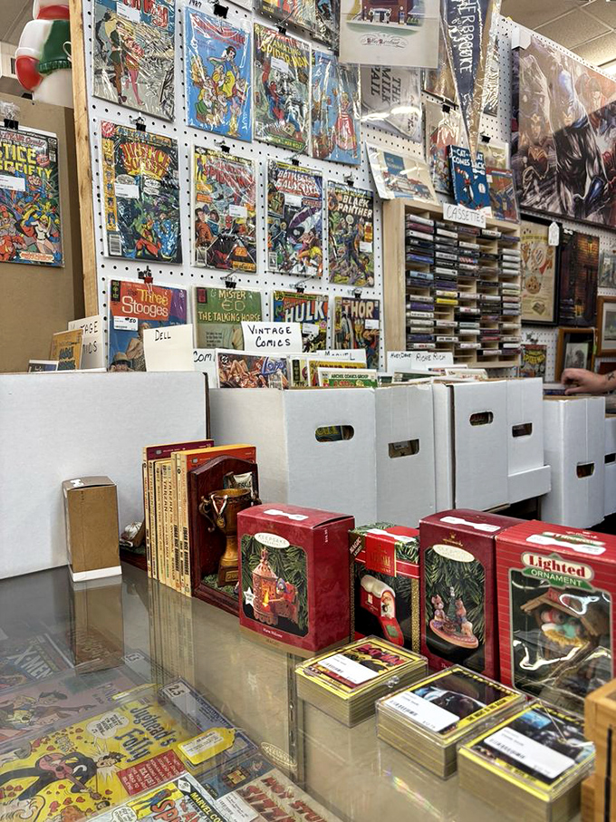Comic book heaven! Vintage superheroes and Three Stooges await collectors while Hallmark ornaments below promise Christmas nostalgia year-round.