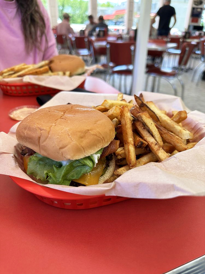 Combo #1 arrives like a Norman Rockwell painting you can eat, nestled in a red basket of nostalgic perfection.