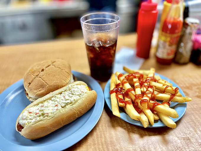The holy trinity of diner perfection: a proper sandwich, crispy fries with just the right amount of ketchup, and an ice-cold soda.