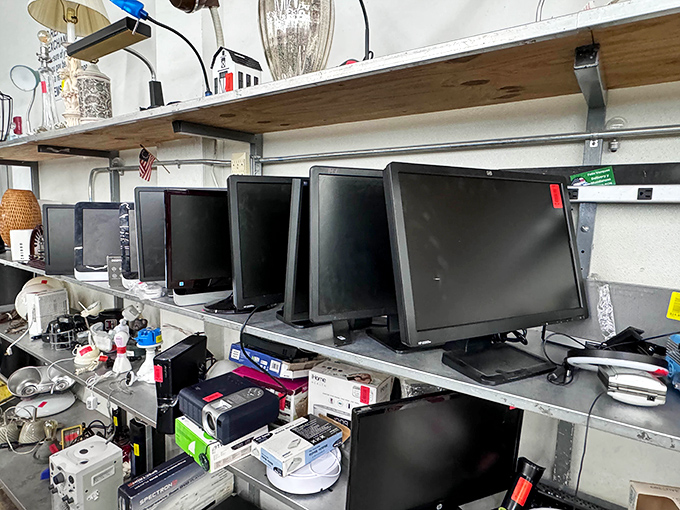 Computer monitors line up like contestants in a beauty pageant where the prize is finding a new home instead of gathering dust.