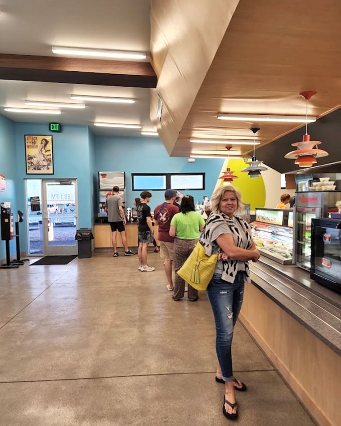 The concession stand interior blends retro charm with modern efficiency, serving up movie munchies with a side of nostalgia.
