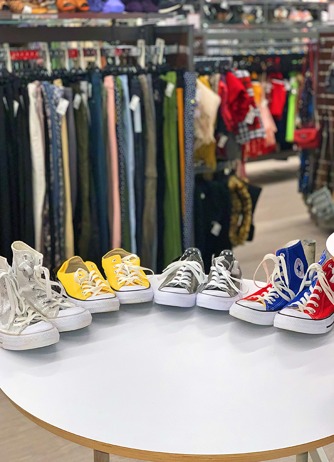A rainbow of Chuck Taylors stands ready for adoption. These iconic sneakers have found their way to second-chance stardom at fraction-of-retail prices.