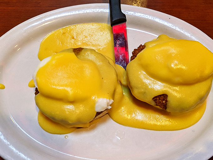 Eggs Benedict with a golden hollandaise blanket so perfect it belongs in the Comfort Food Hall of Fame. This is breakfast elevated to an art form.