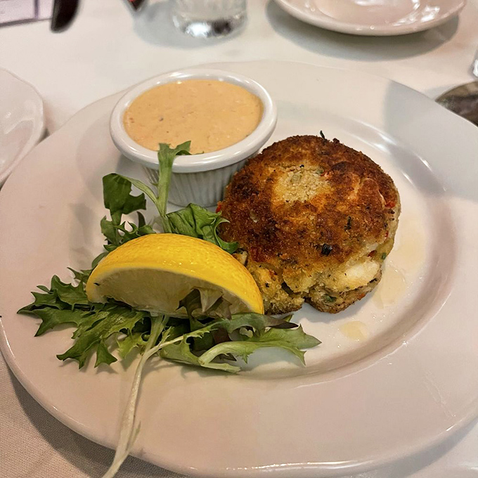 A crab cake that's actually about the crab, not the cake&mdash;served with a sauce that should be bottled and sold as liquid gold.