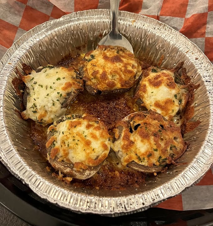 These aren't just stuffed mushrooms&mdash;they're little umami bombs where land meets sea in perfect harmony. The cheese creates a golden crown worthy of royalty.
