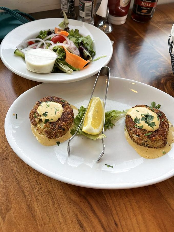 Crab cakes that are actually crab, not filler with a seafood rumor. That sauce deserves its own fan club.