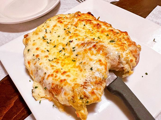 The Crabby Pretzel arrives looking like something that would make cardiologists nervous and taste buds ecstatic.