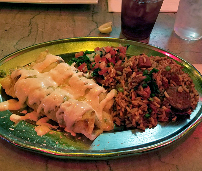 Crawfish enchiladas with dirty rice&mdash;proof that the best culinary innovations happen when cultures collide and decide to be friends.