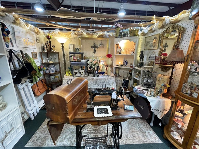 This vintage sewing machine vignette looks like your grandmother's parlor, if grandma had impeccable taste and collecting skills.