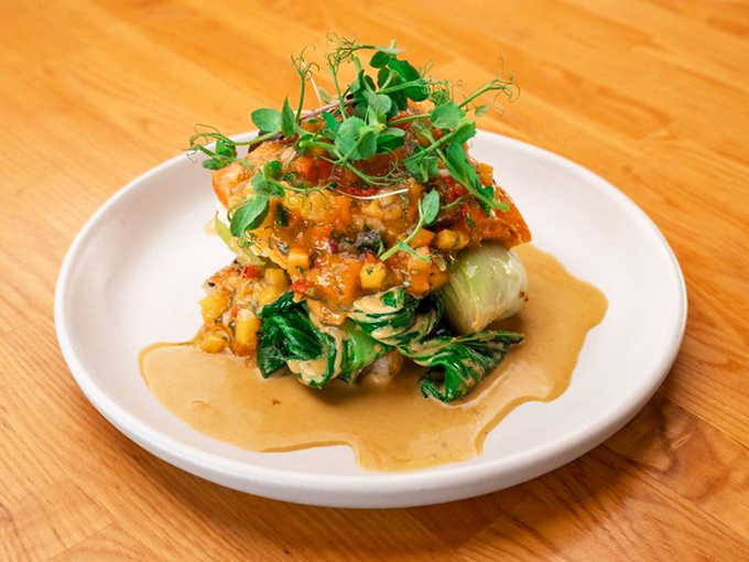 Curry-kissed salmon transforms familiar fish into an exotic adventure without requiring a passport or shots.