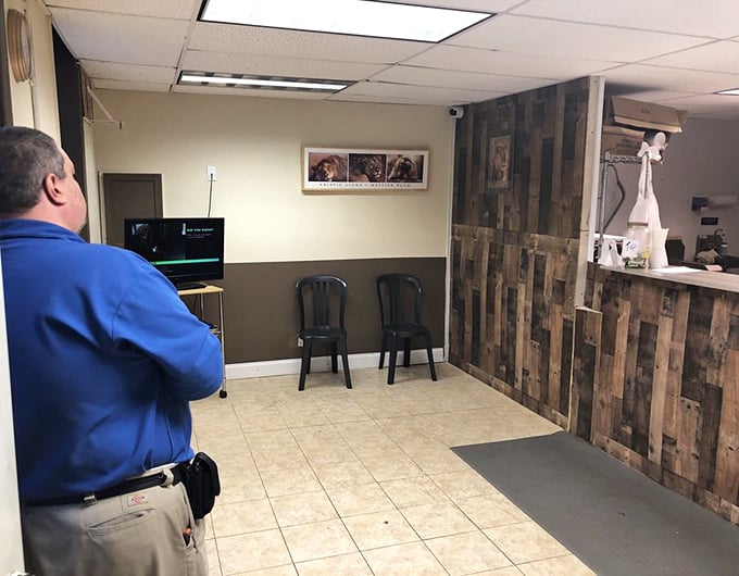 The dining area offers a view of the kitchen where culinary magic happens, with rustic wood accents adding warmth to the space.