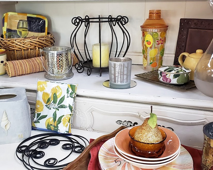 Lemon-themed decor and elegant candle holders await their second act in your home. These aren't just housewares; they're stories waiting to continue.