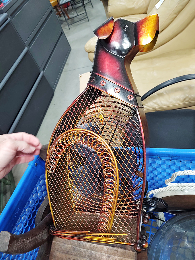 Not just a fan&mdash;a statement piece! This metal dog sculpture combines function with whimsy, perfect for the person who has everything.