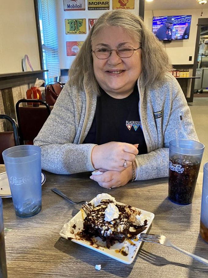 Between bites of homemade dessert, conversations flow as naturally as the coffee refills at this community gathering spot.