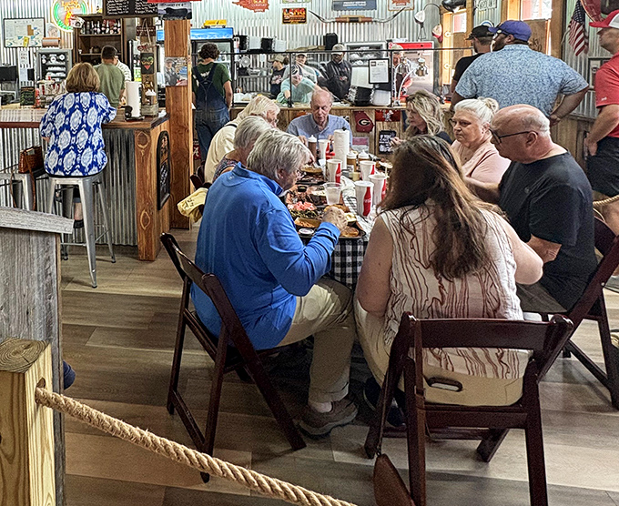The true measure of a barbecue joint: a diverse crowd united by the universal language of "mmm" and the strategic deployment of extra napkins.