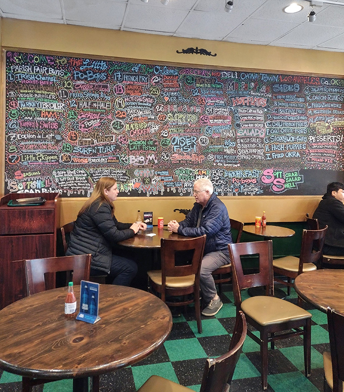 Against a backdrop of colorful menu art, diners share stories and bites&mdash;proof that great food creates its own community, even 1,900 miles from the source.