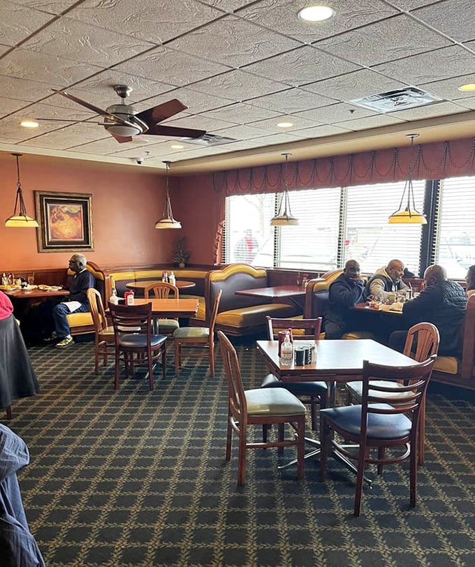 The dining room hums with the universal language of breakfast appreciation, where strangers are united by pancake devotion.