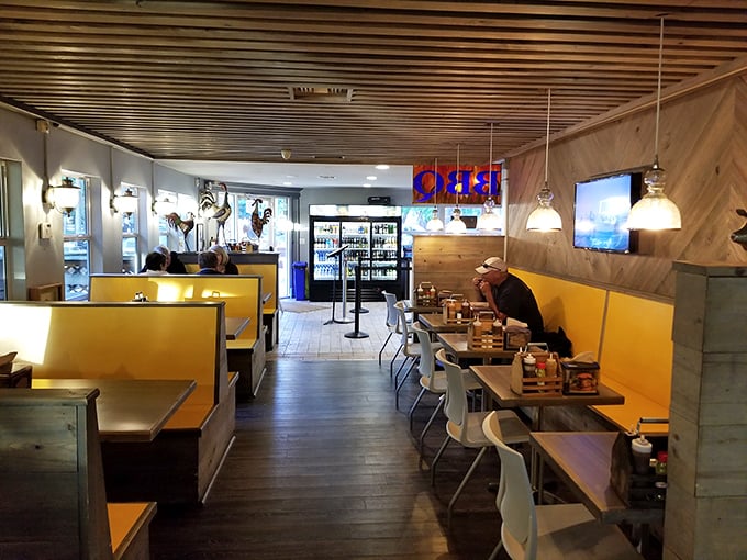 Where strangers become friends over shared barbecue revelations. The yellow booths have witnessed countless "Oh my goodness" moments as first-timers discover the magic.