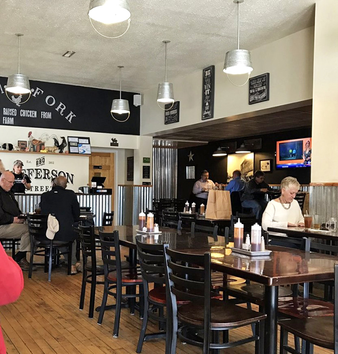 The dining room buzzes with the universal language of barbecue appreciation. Notice how nobody's talking? That's because their mouths are happily full.
