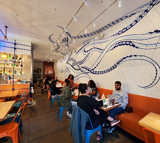 The communal joy of seafood boils on display&mdash;strangers united by blue chairs, good food, and the shared experience of sauce-slicked fingers.