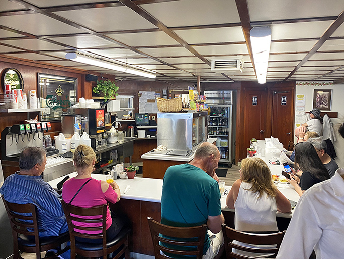 Counter seating where you can watch the breakfast ballet unfold while chatting with fellow pancake enthusiasts over endless coffee.