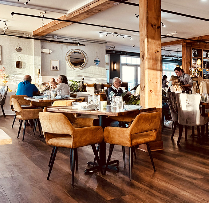 The warm wood tones and comfortable seating create the perfect backdrop for that moment when food becomes the main conversation.