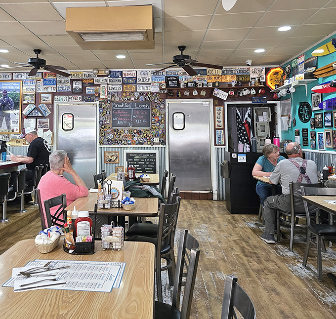 The dining room feels like a community living room where strangers become friends over coffee refills. License plates tell tales of far-off visitors.