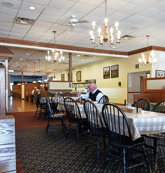 The dining room's quiet elegance, with Windsor chairs and checkered tablecloths, creates the perfect backdrop for the impending food euphoria about to take place.