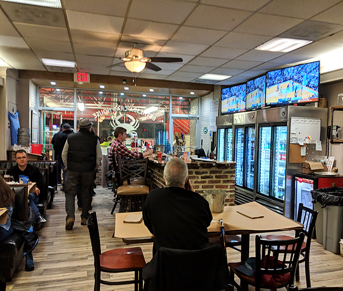 The dining room buzzes with the energy of locals and visitors united in their quest for perfect crabs. TVs in the background, but all eyes are on the seafood.